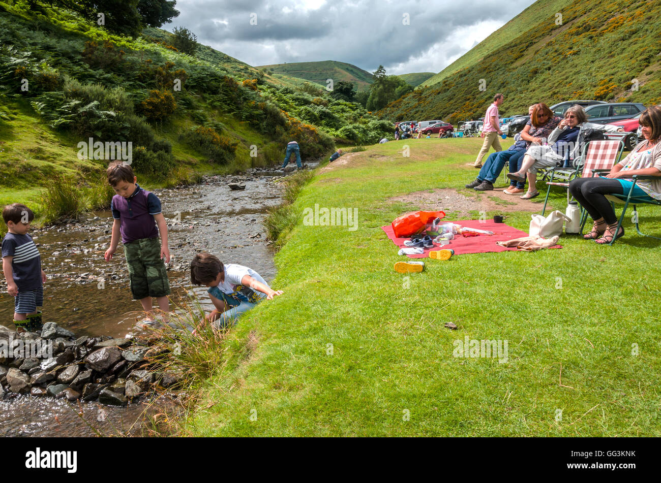 A view down Carding Mill in Shropshire. Young children play in the ...