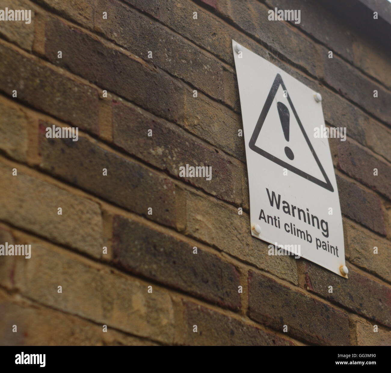 Anti climb sign Stock Photo - Alamy