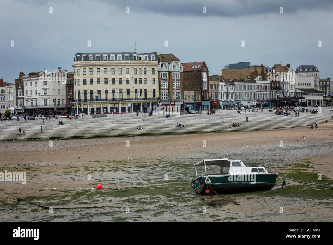 Boat on the beach at low tide at Margate with the seafront buildings in ...