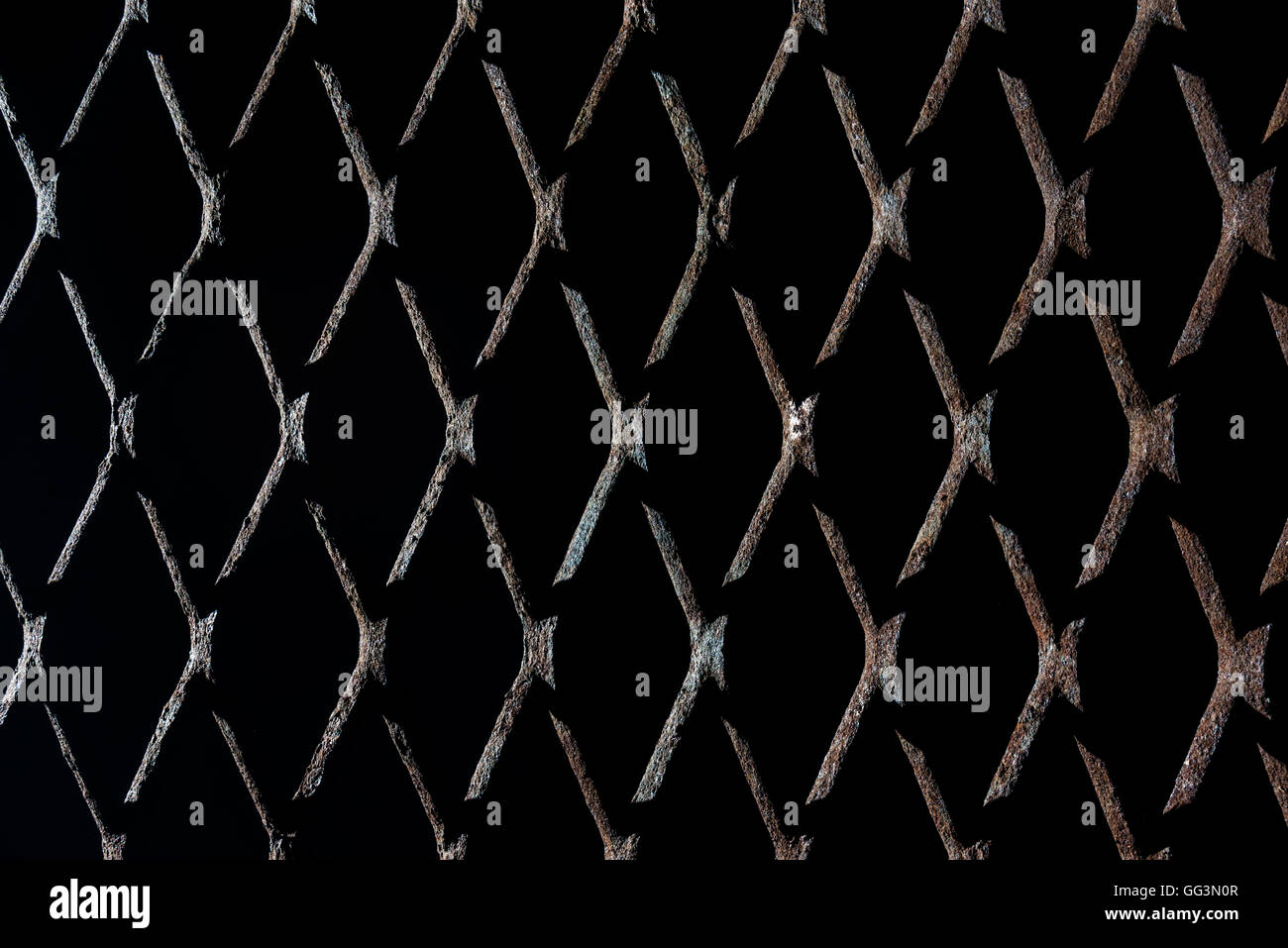 Texture or background of rusty expanded metal on black background Stock ...