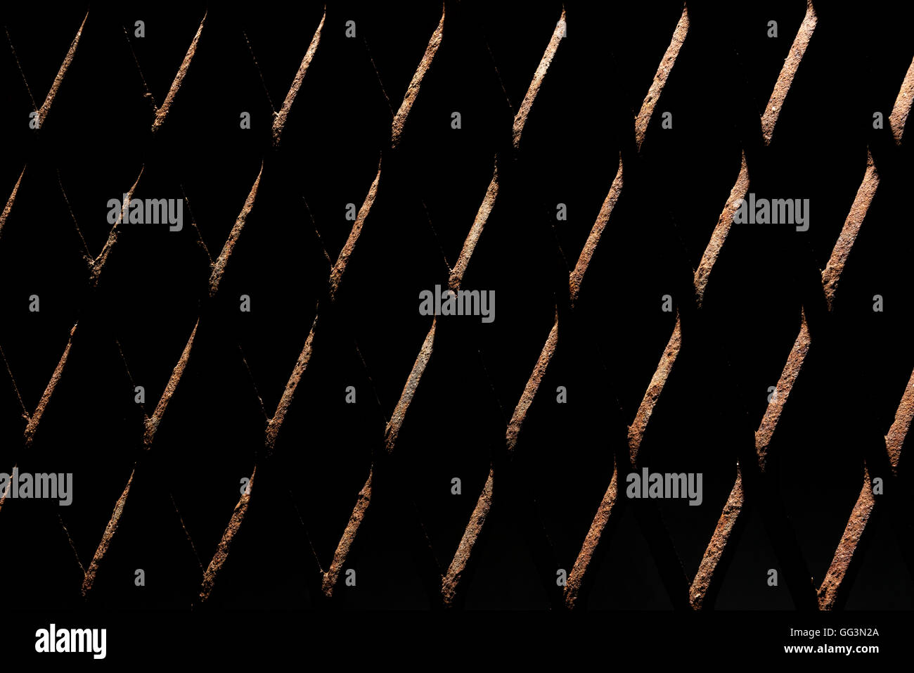 Texture or background of rusty expanded metal on black background Stock ...