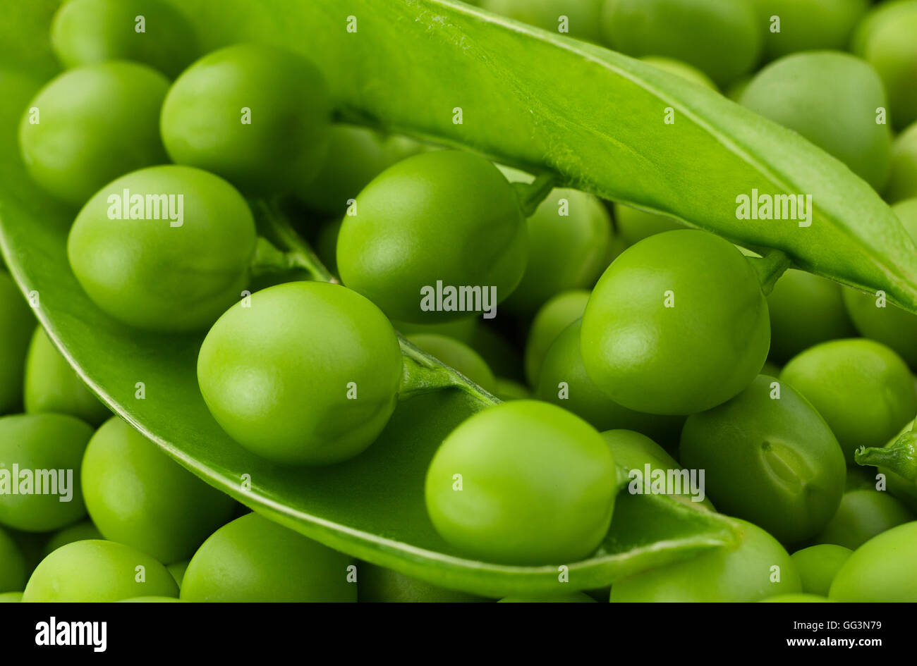 Young grean peas closeup isolated on white background Stock Photo - Alamy