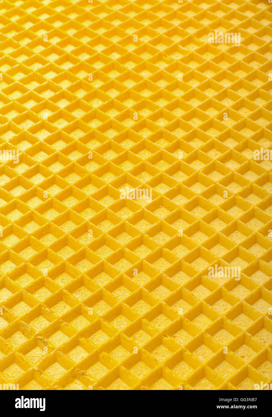 Yellow wafer textured surface closeup background Stock Photo - Alamy