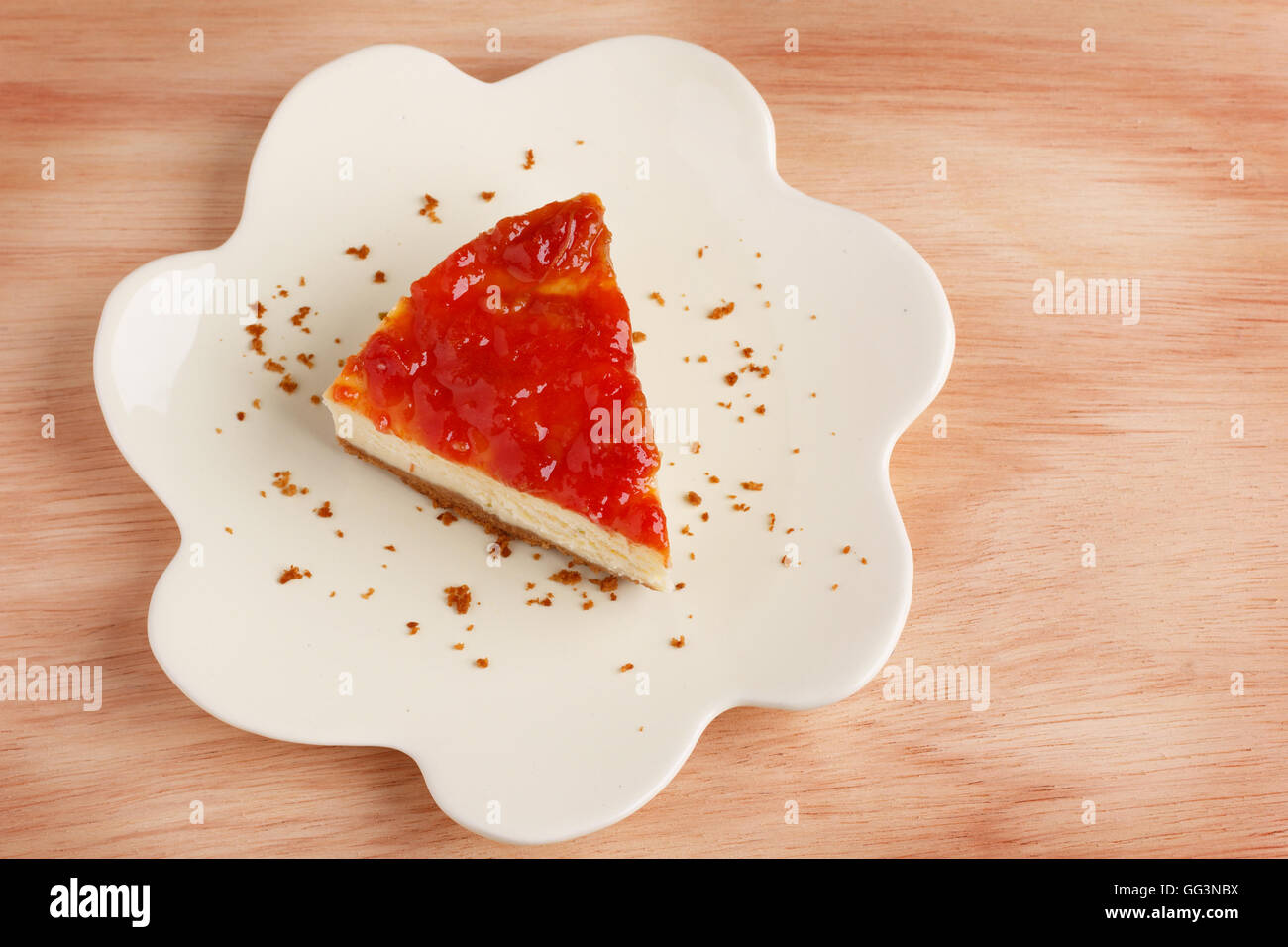 Cheesecake with brazilian goiabada jam of guava on plate on wooden ...