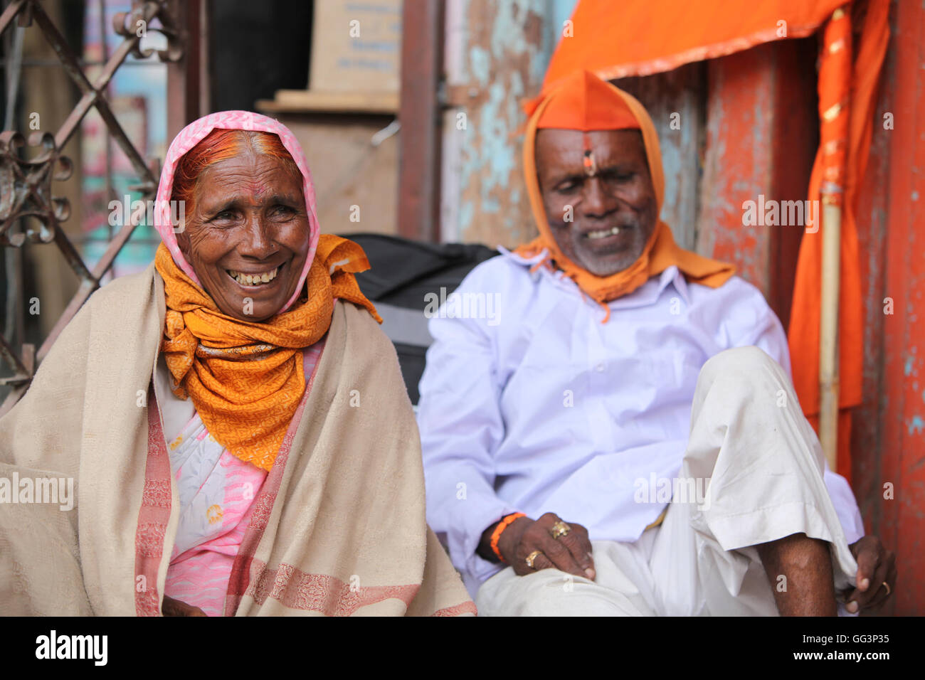 A portrait of an old pilgrim woman smiling happily during an Indian ...