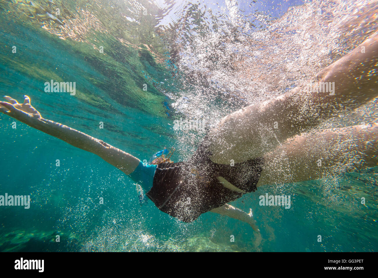 Woman free diving Stock Photo - Alamy