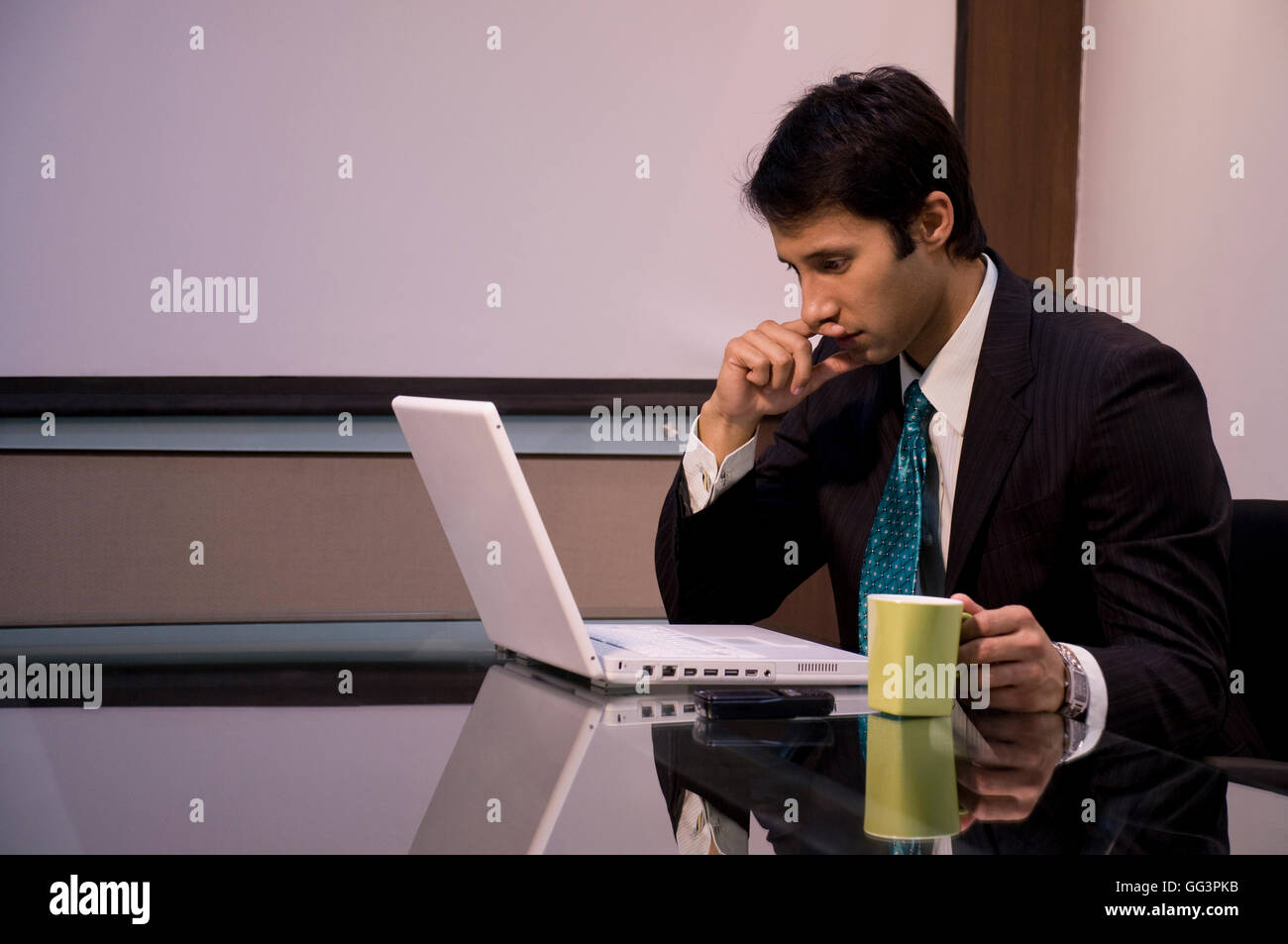 Business executive with laptop Stock Photo - Alamy