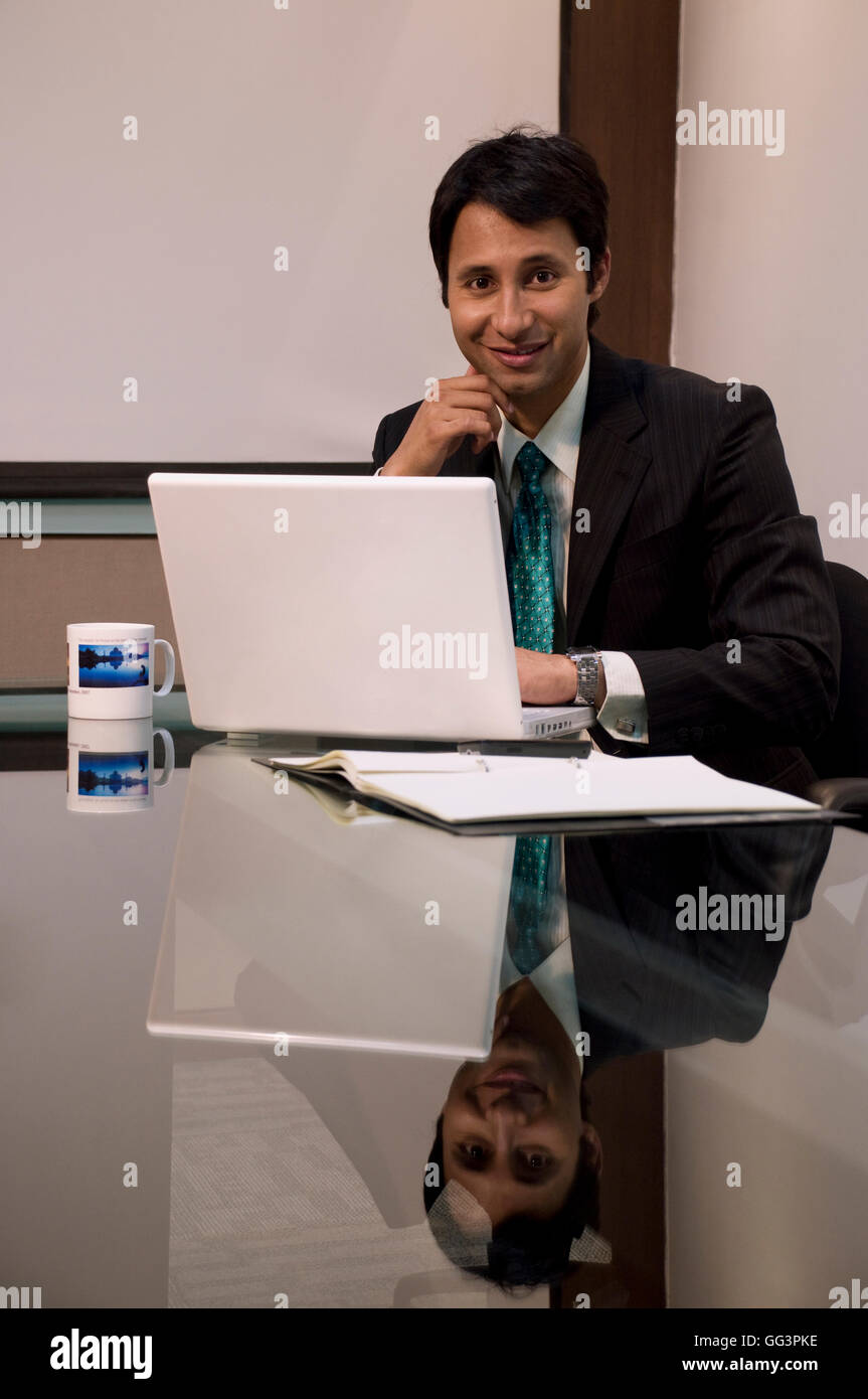 Business executive with laptop Stock Photo - Alamy