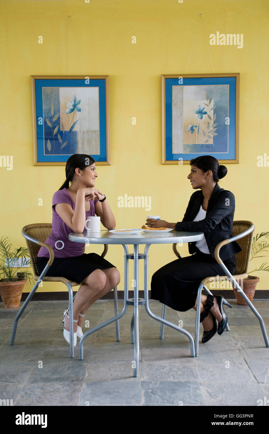 Indians talking sitting hi-res stock photography and images - Alamy