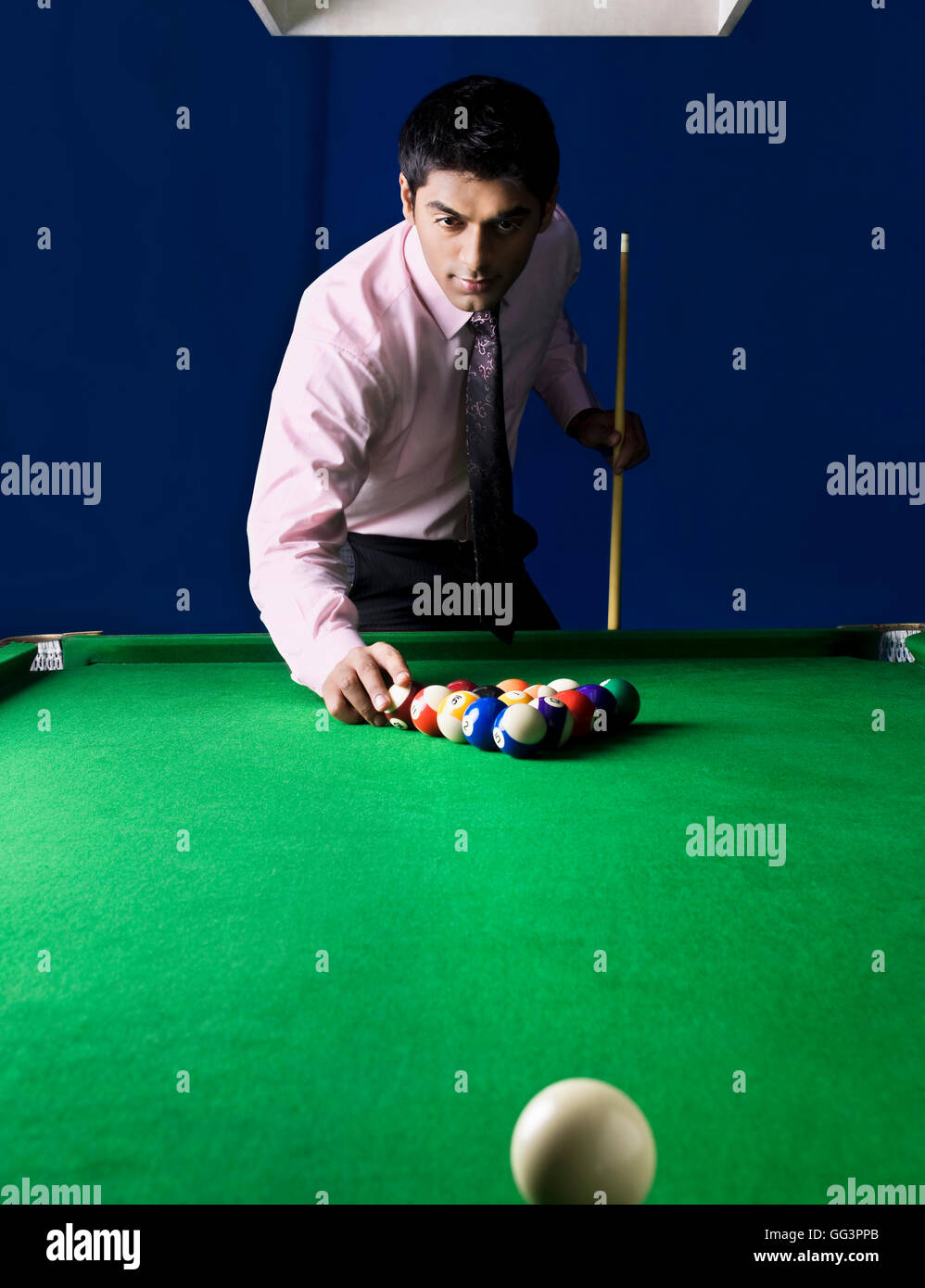 Man arranging billiard balls Stock Photo - Alamy