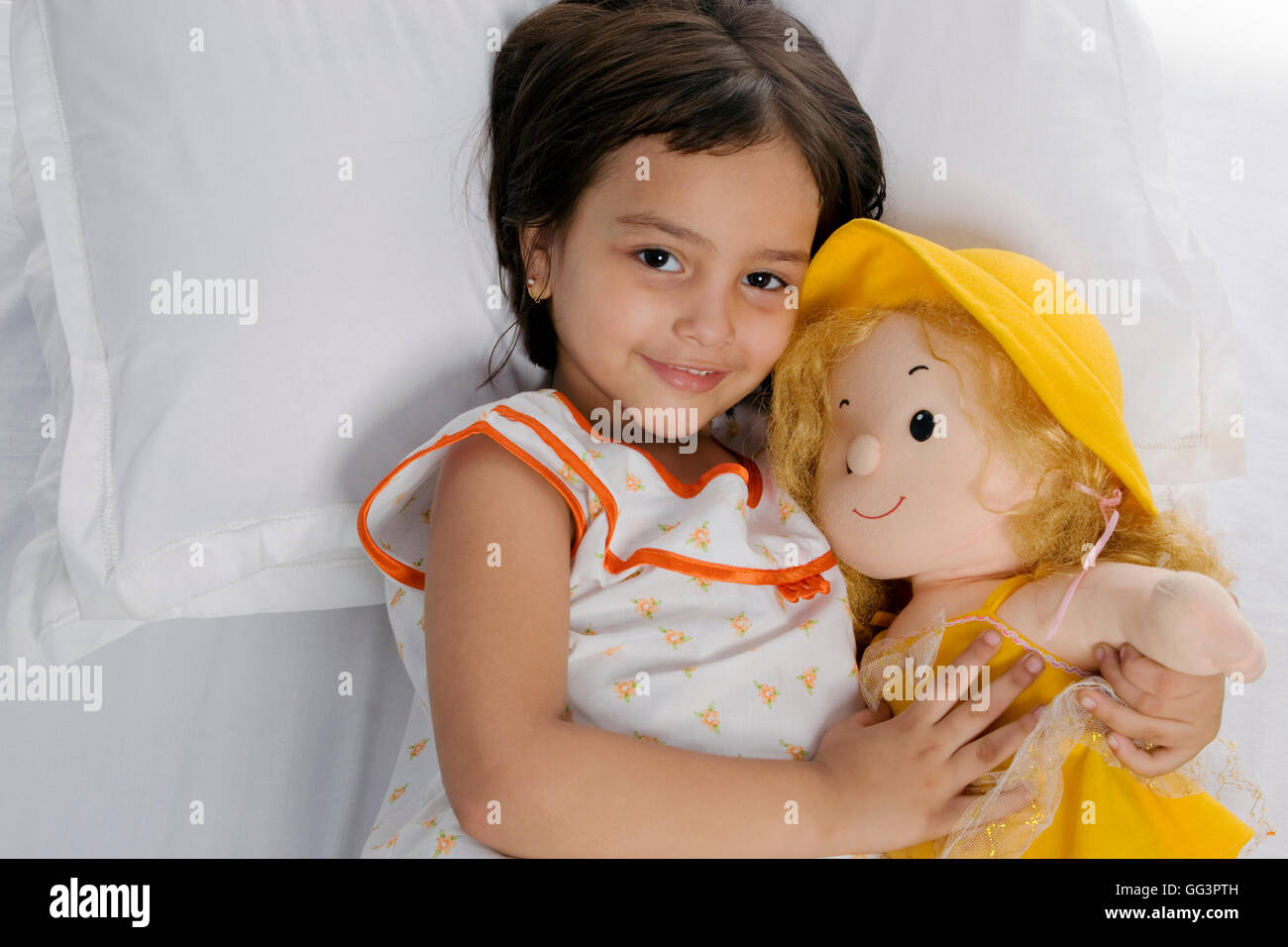 A girl with her doll Stock Photo - Alamy