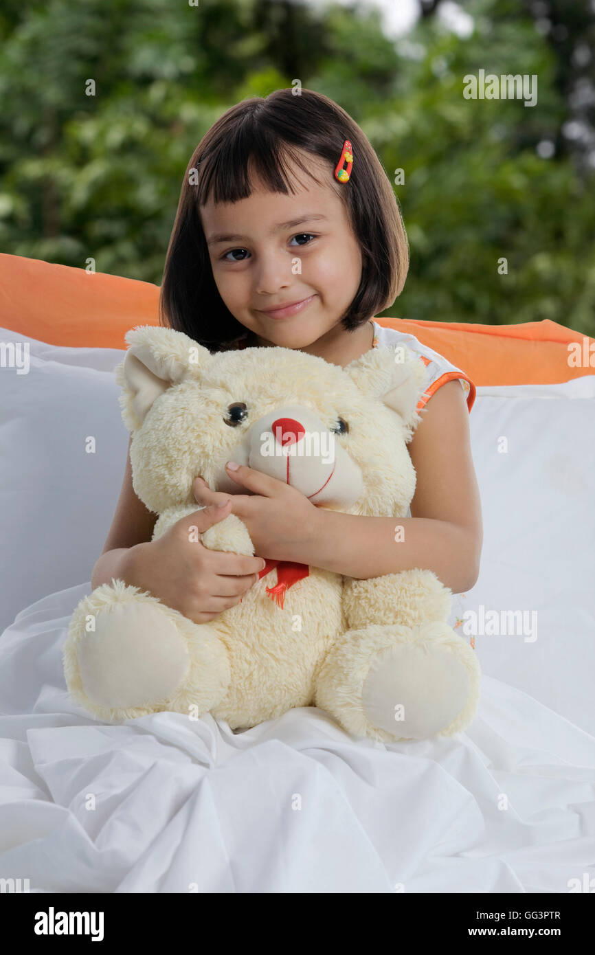 A girl with her teddy bear Stock Photo - Alamy