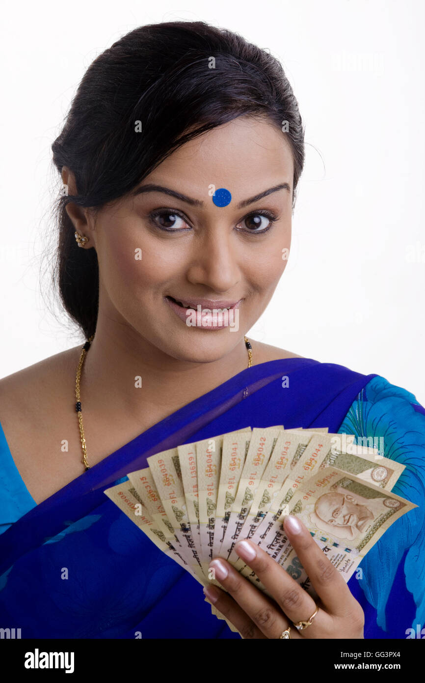 Holding some money Stock Photo - Alamy