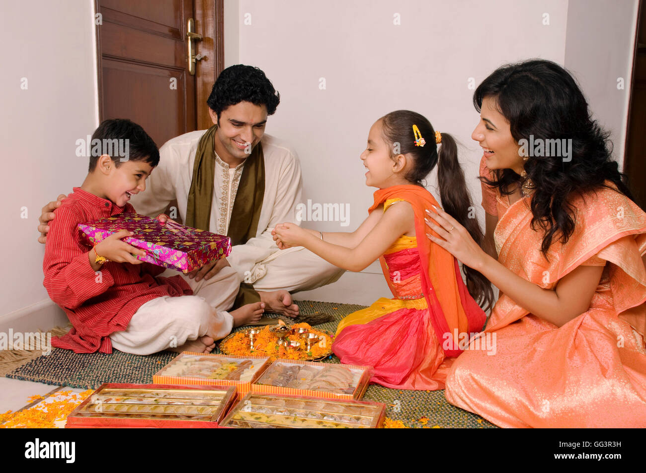 Boy giving presents Stock Photo - Alamy