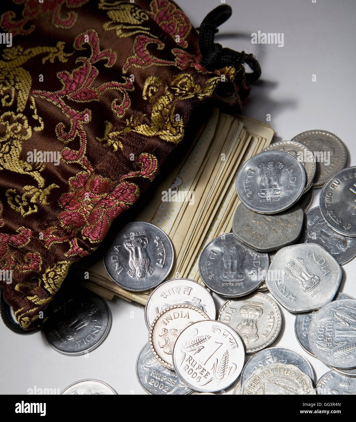 Coins and currency notes Stock Photo - Alamy