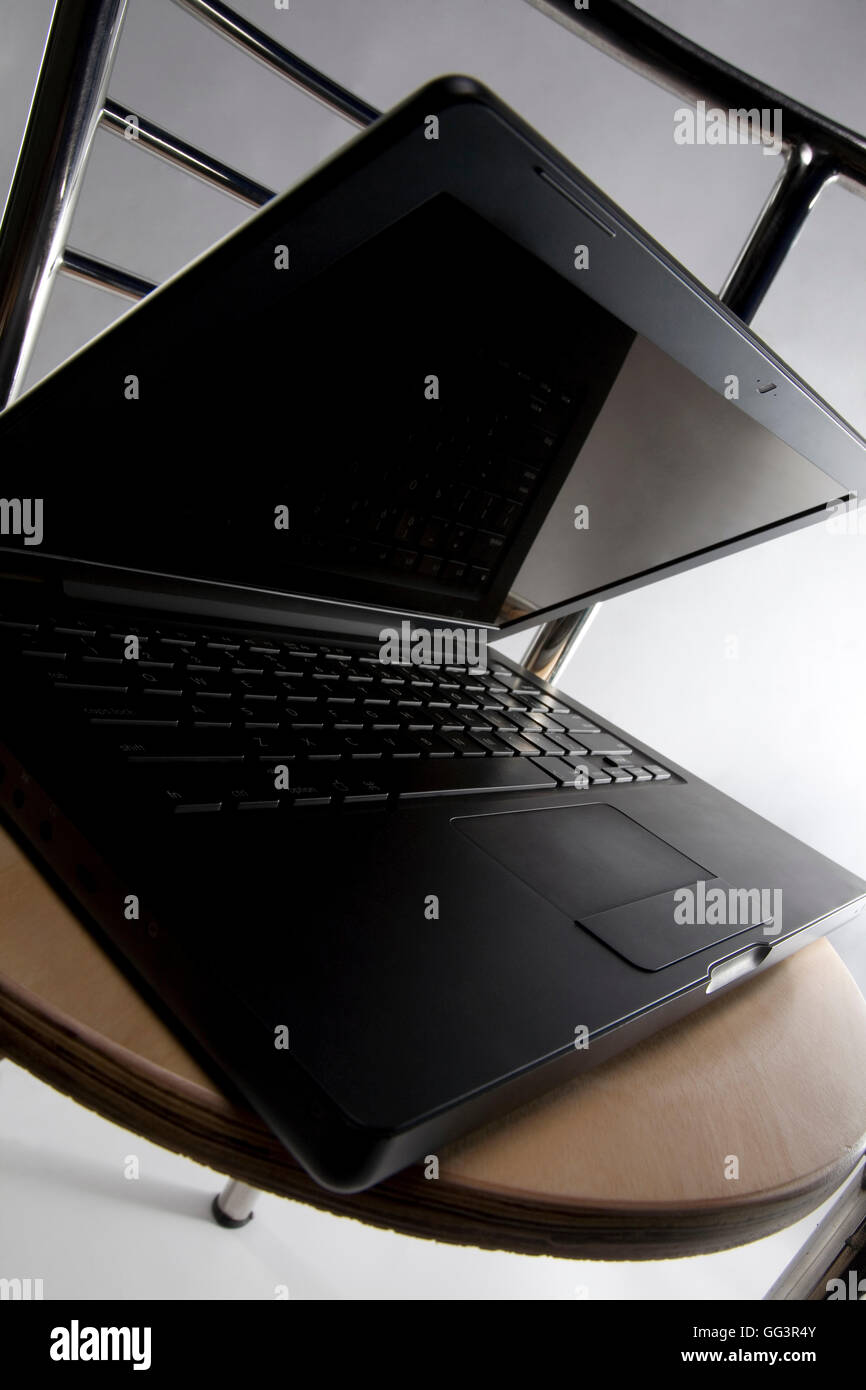 Laptop on a chair Stock Photo - Alamy