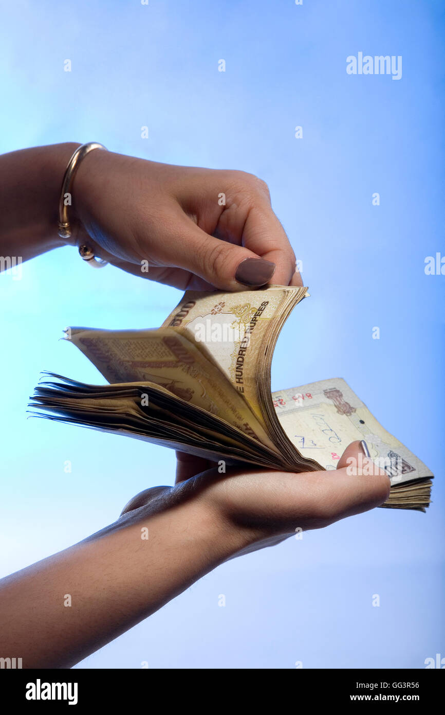 Person counting money Stock Photo - Alamy