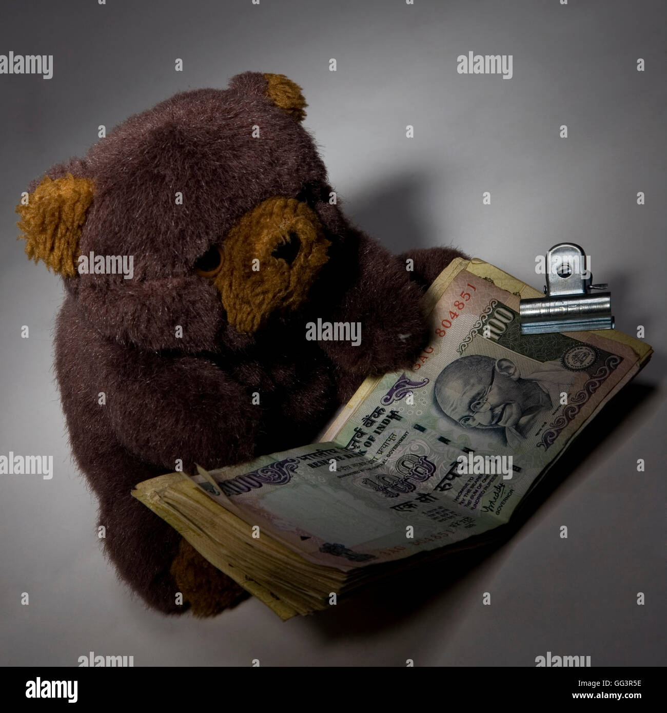 Teddy bear with money Stock Photo - Alamy