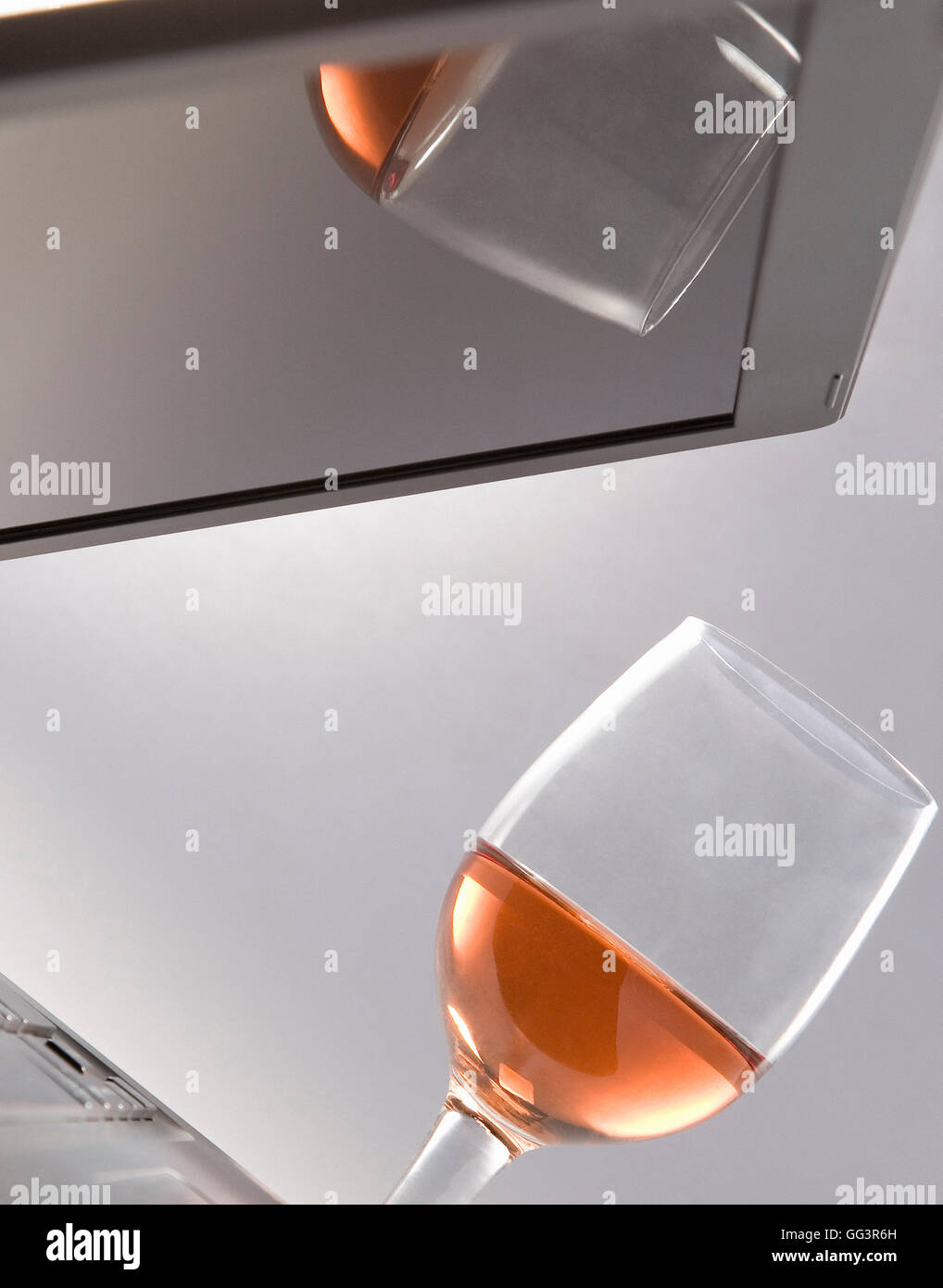A laptop and a glass Stock Photo - Alamy