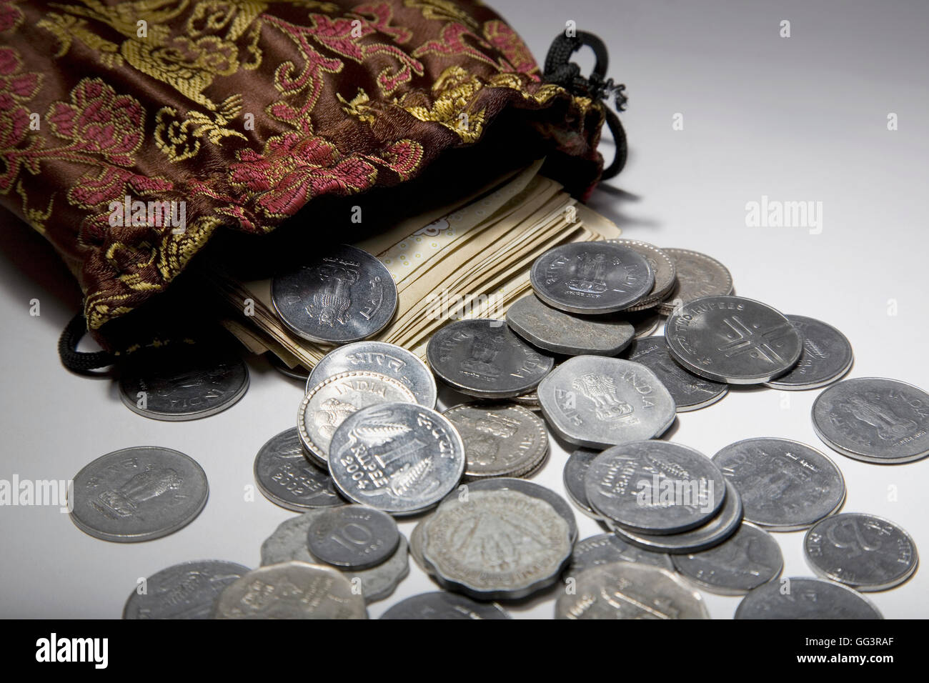 Coins and currency notes Stock Photo - Alamy