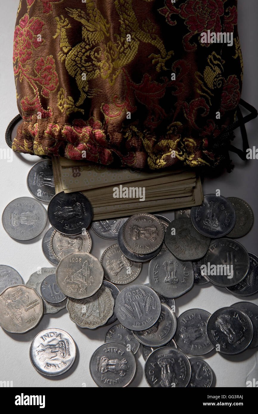 Coins and currency notes Stock Photo - Alamy
