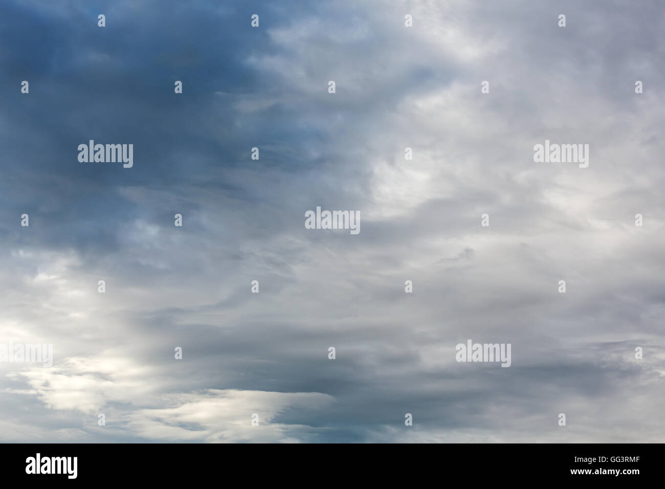 background of dark sky with overcast grey clouds before thunderstorm ...