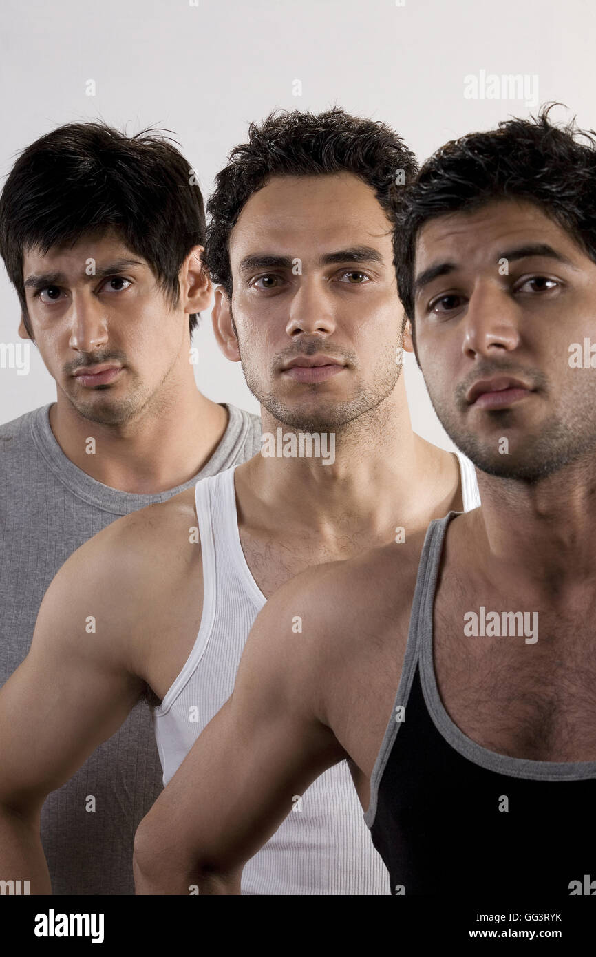 Three men posing Stock Photo - Alamy