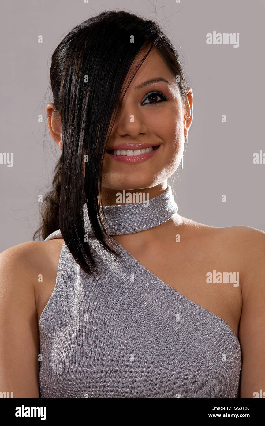 Woman posing and smiling Stock Photo - Alamy