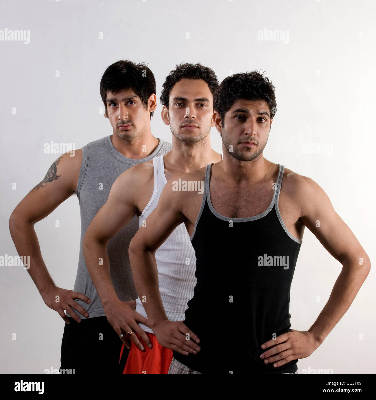 Three men posing Stock Photo - Alamy