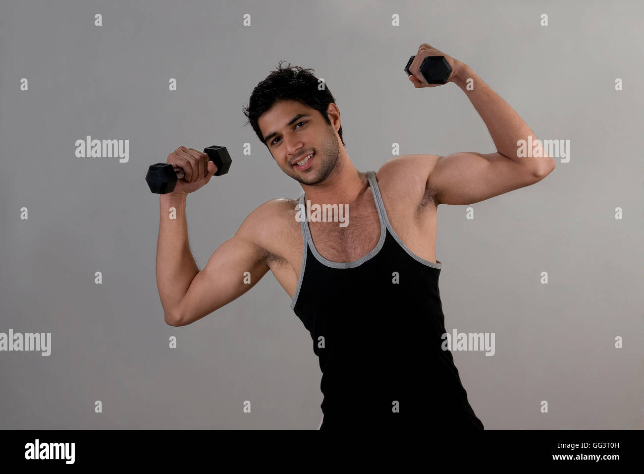Man lifting weights Stock Photo - Alamy