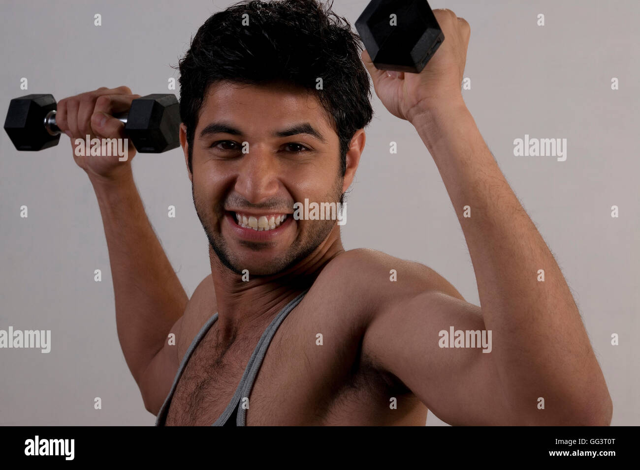Young man lifts weights hi-res stock photography and images - Alamy