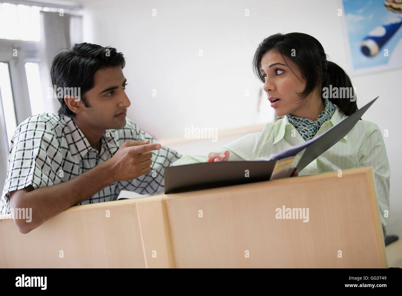 Talking in the office Stock Photo - Alamy
