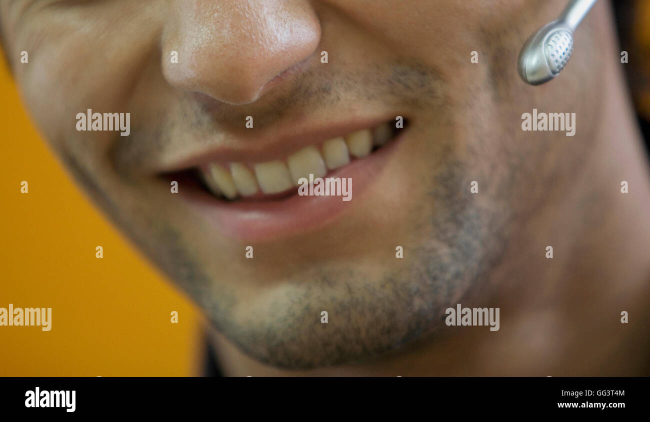 Executive talking on microphone Stock Photo - Alamy