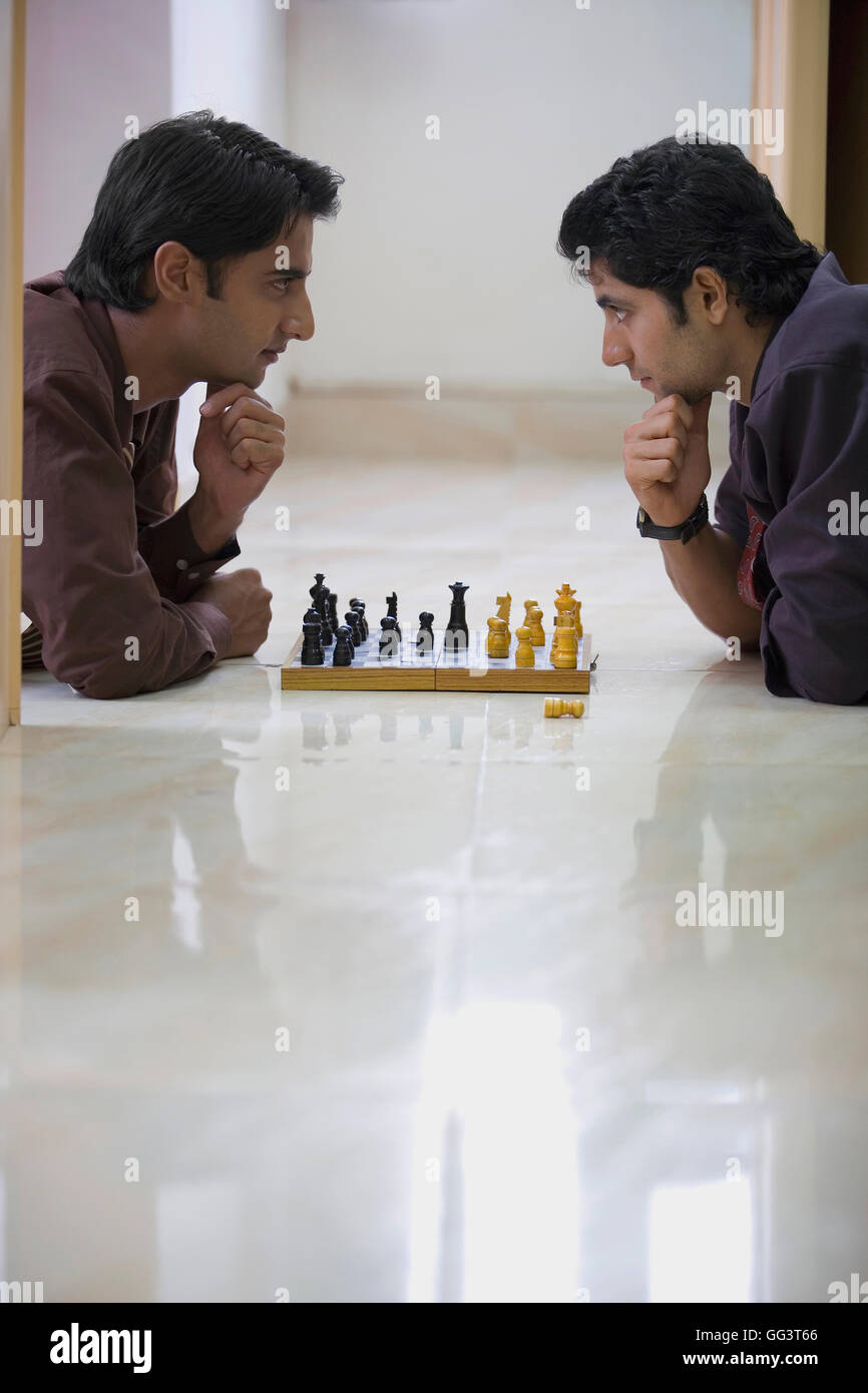 Men playing chess Stock Photo - Alamy