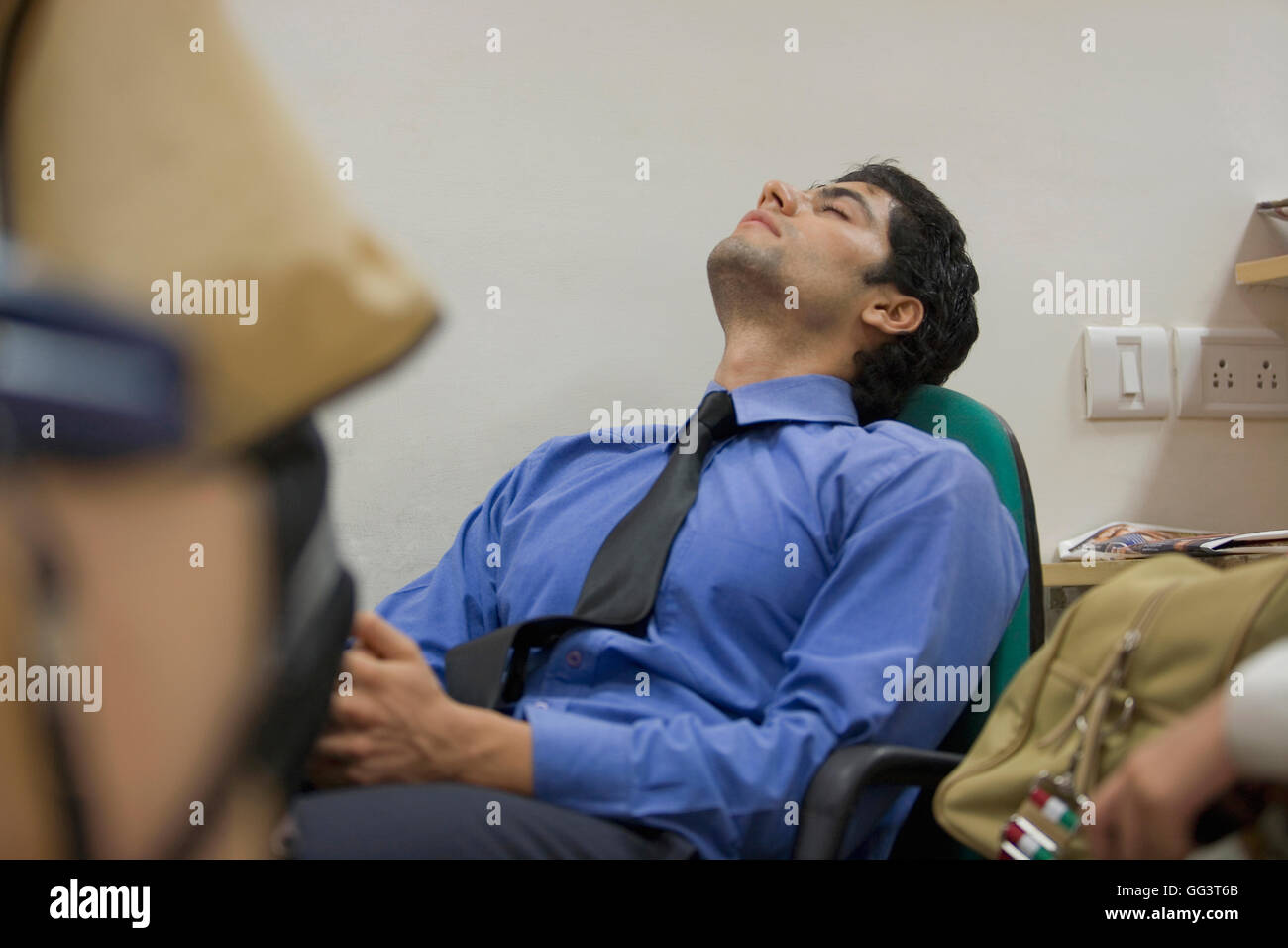 Sleeping in the office Stock Photo - Alamy