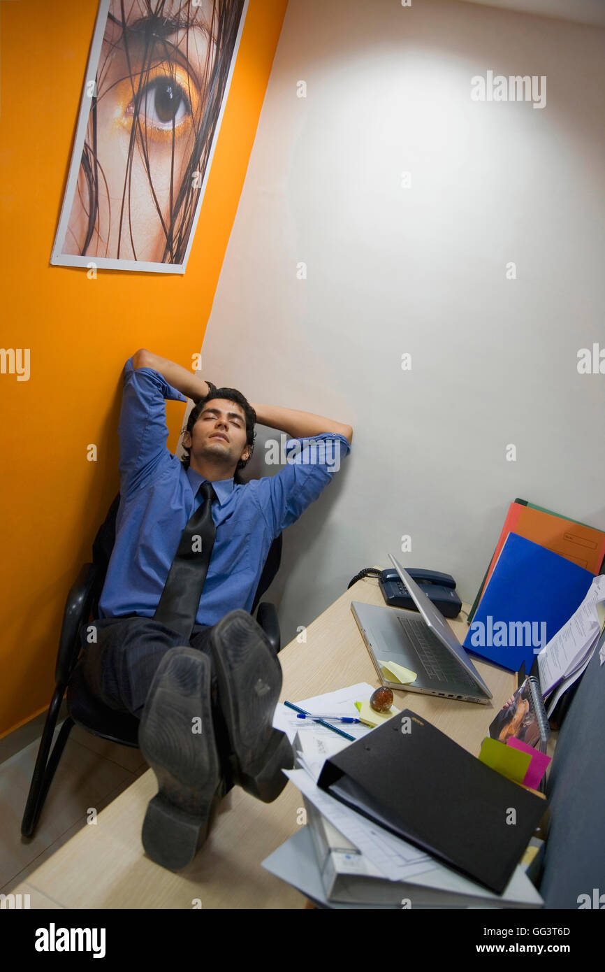 Man sleeping in the office Stock Photo - Alamy