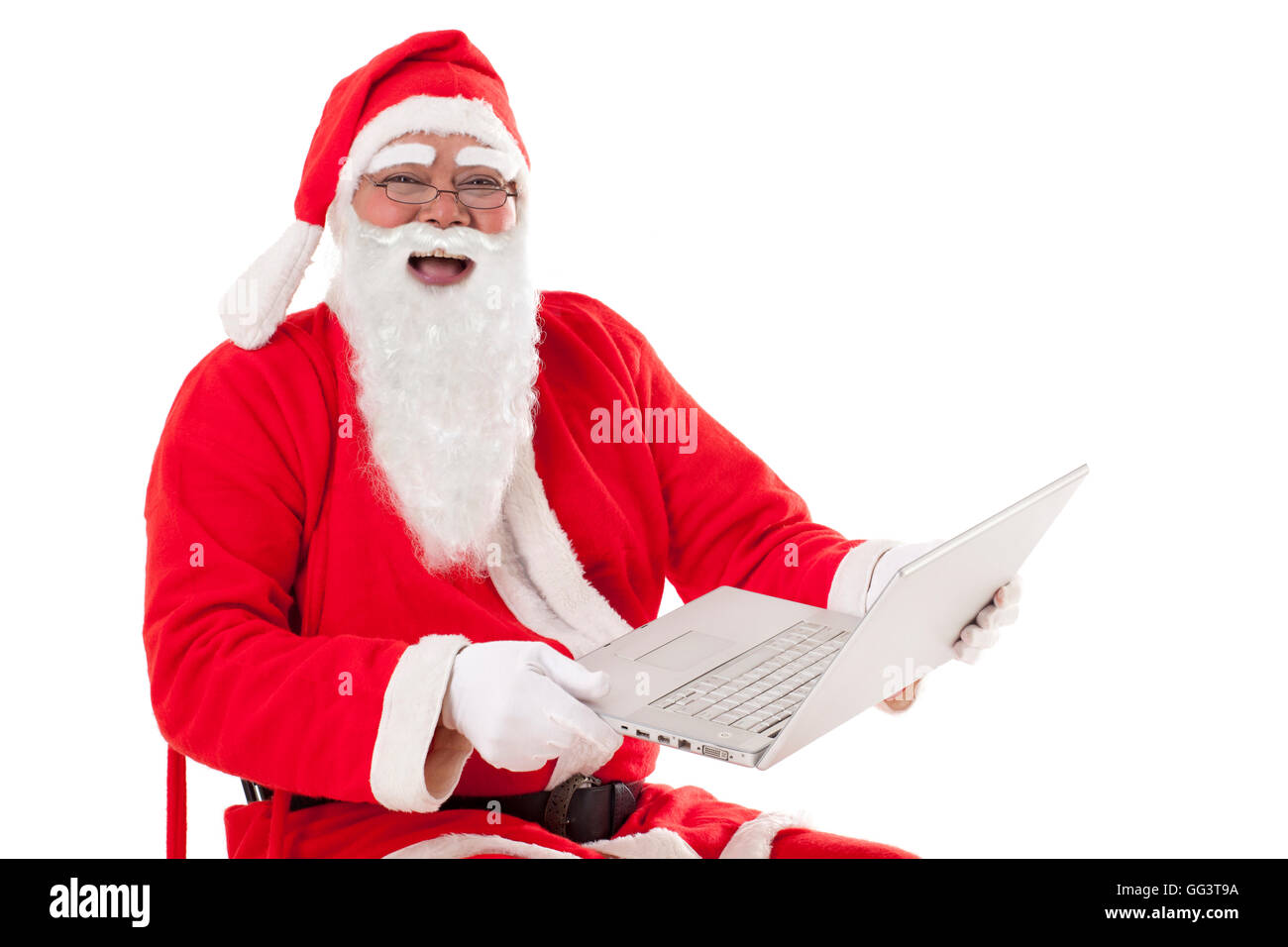 Happy Santa Claus using laptop over white background Stock Photo - Alamy