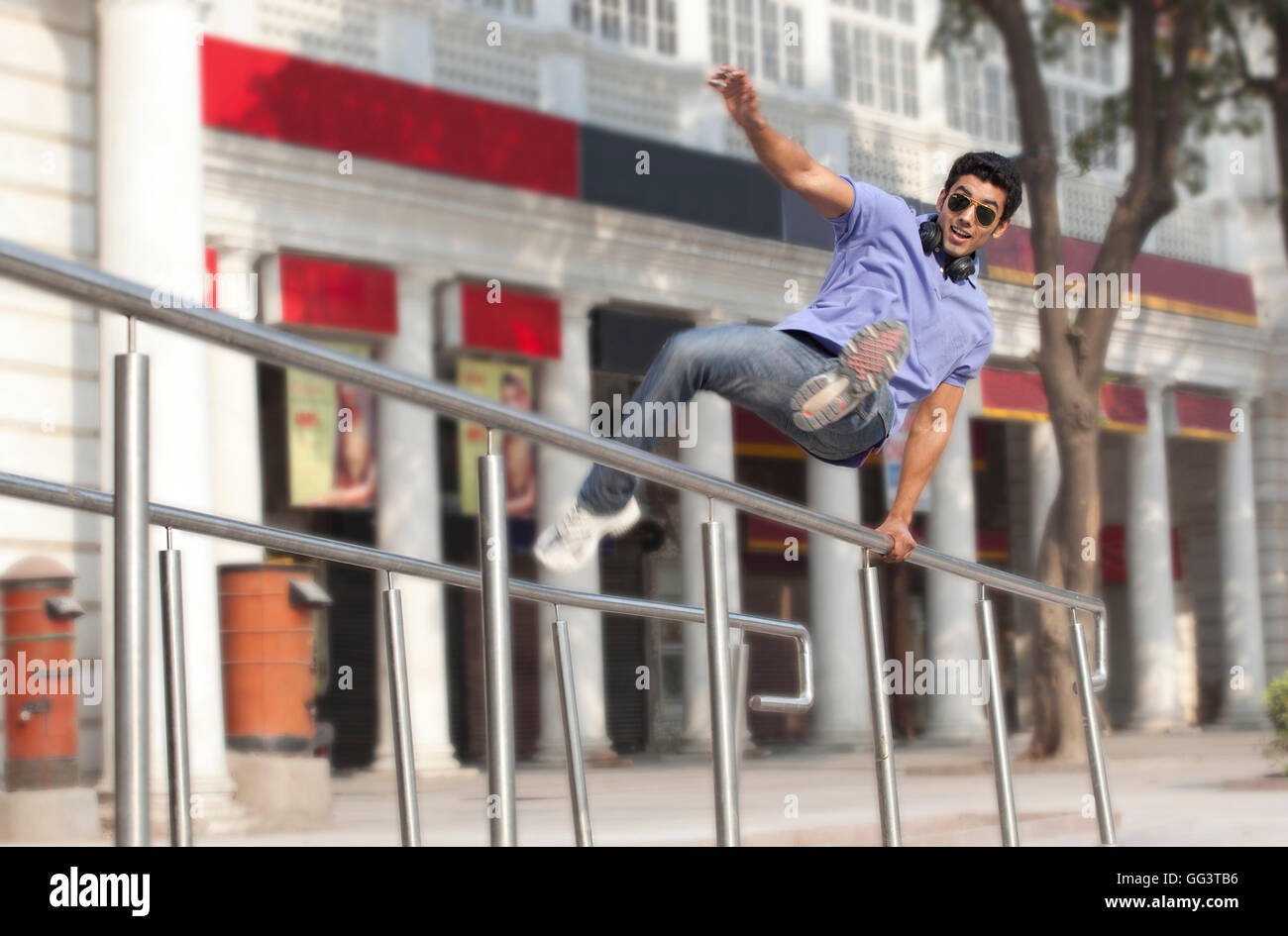 Man jumping over railings hi-res stock photography and images - Alamy