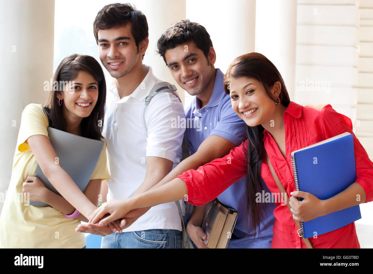 University students stacking their hands Stock Photo - Alamy