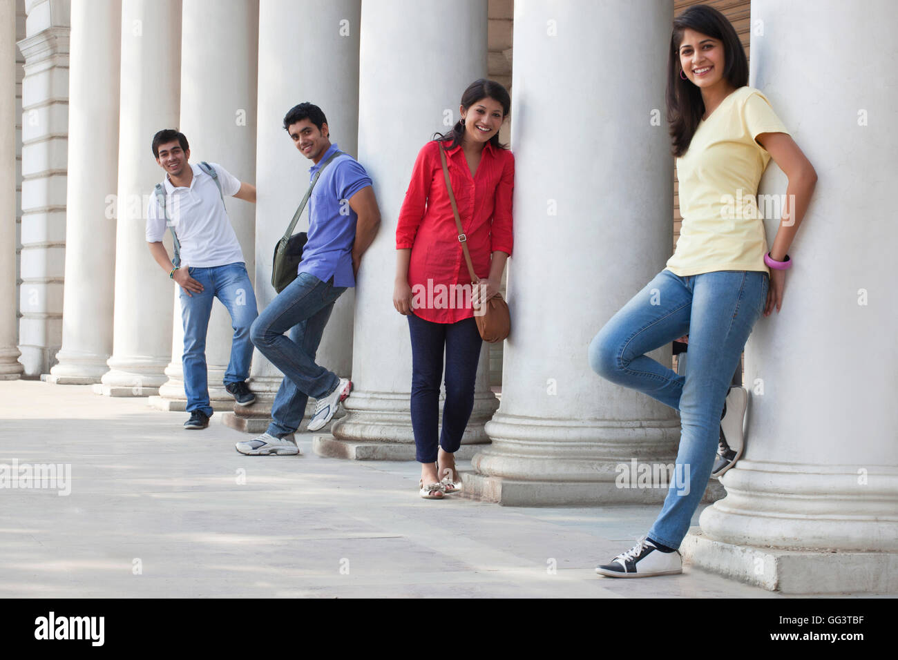 Portrait of four college students posing Stock Photo - Alamy