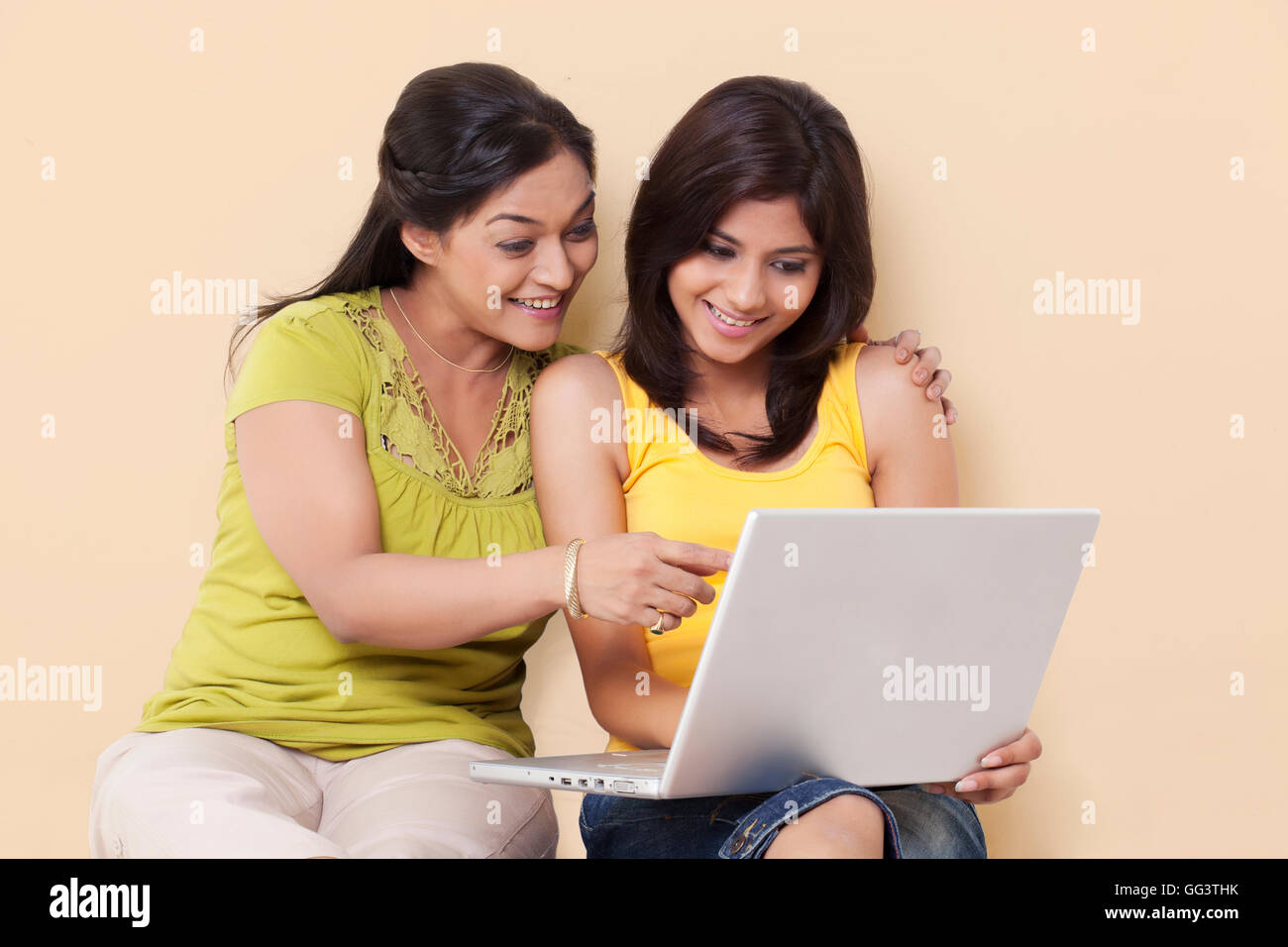 Mother and daughter using computer together Stock Photo - Alamy