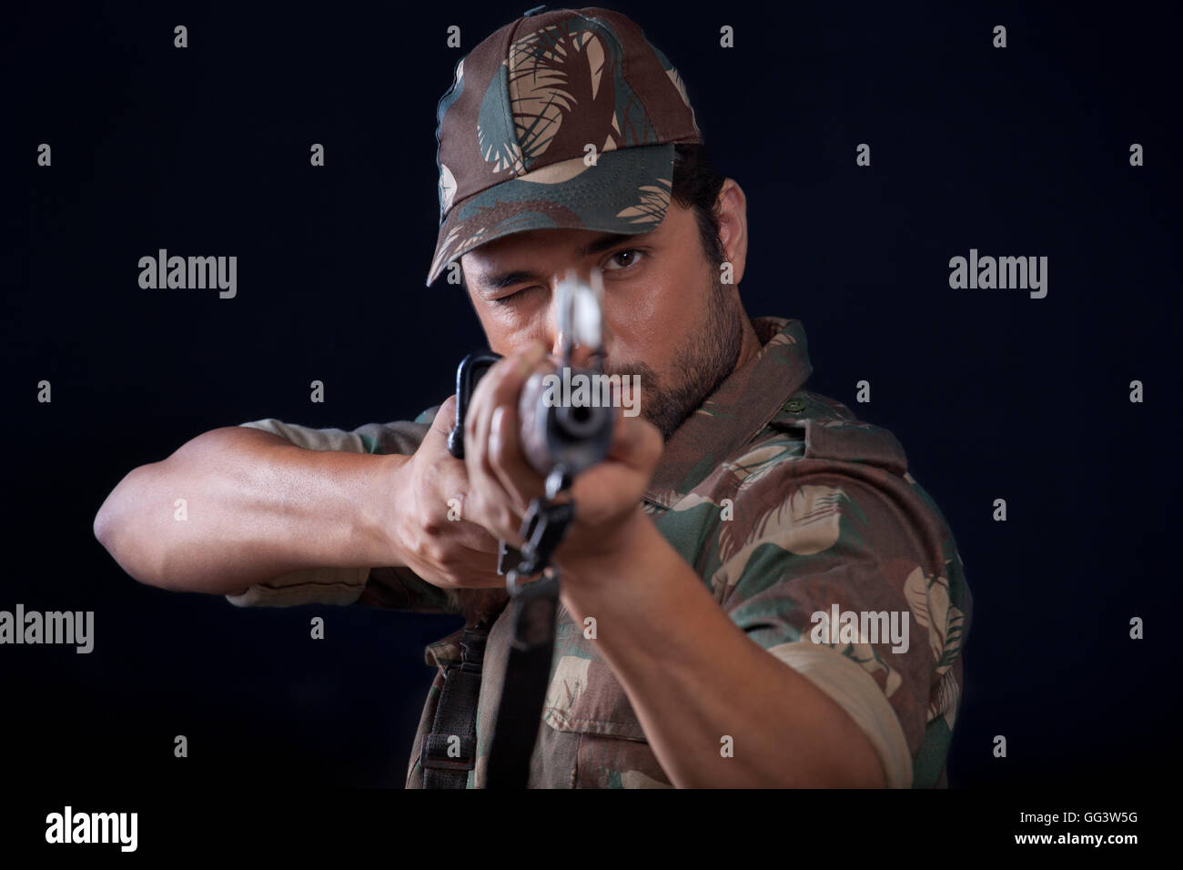Close-up of male soldier aiming gun Stock Photo - Alamy