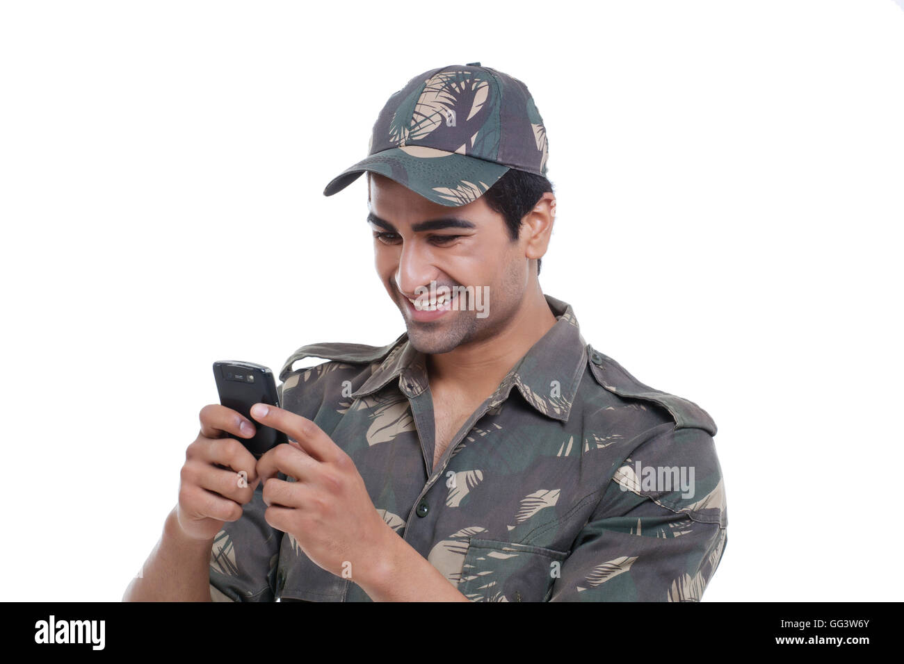 Happy soldier text messaging Stock Photo - Alamy