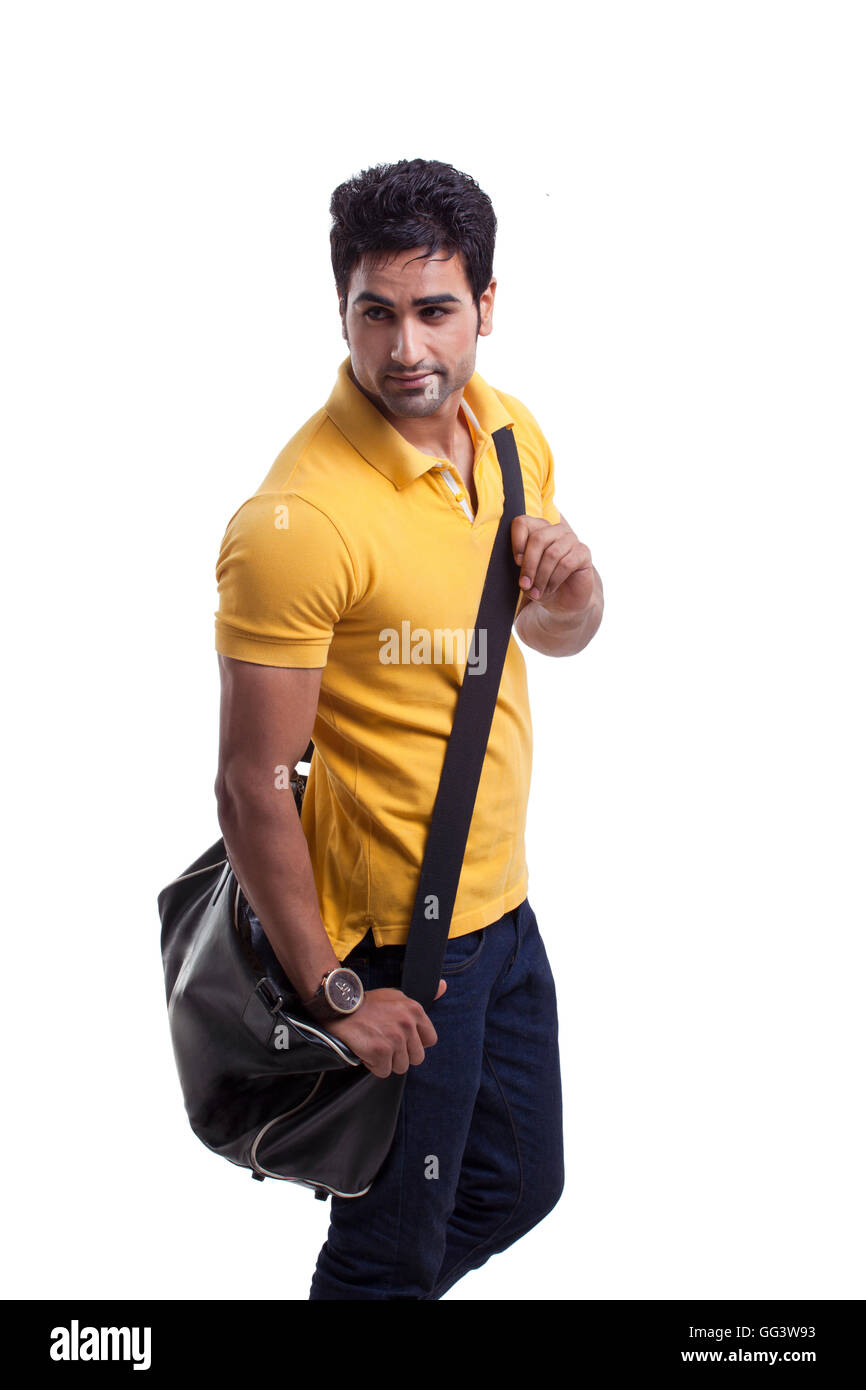 Handsome young man with duffel bag Stock Photo - Alamy