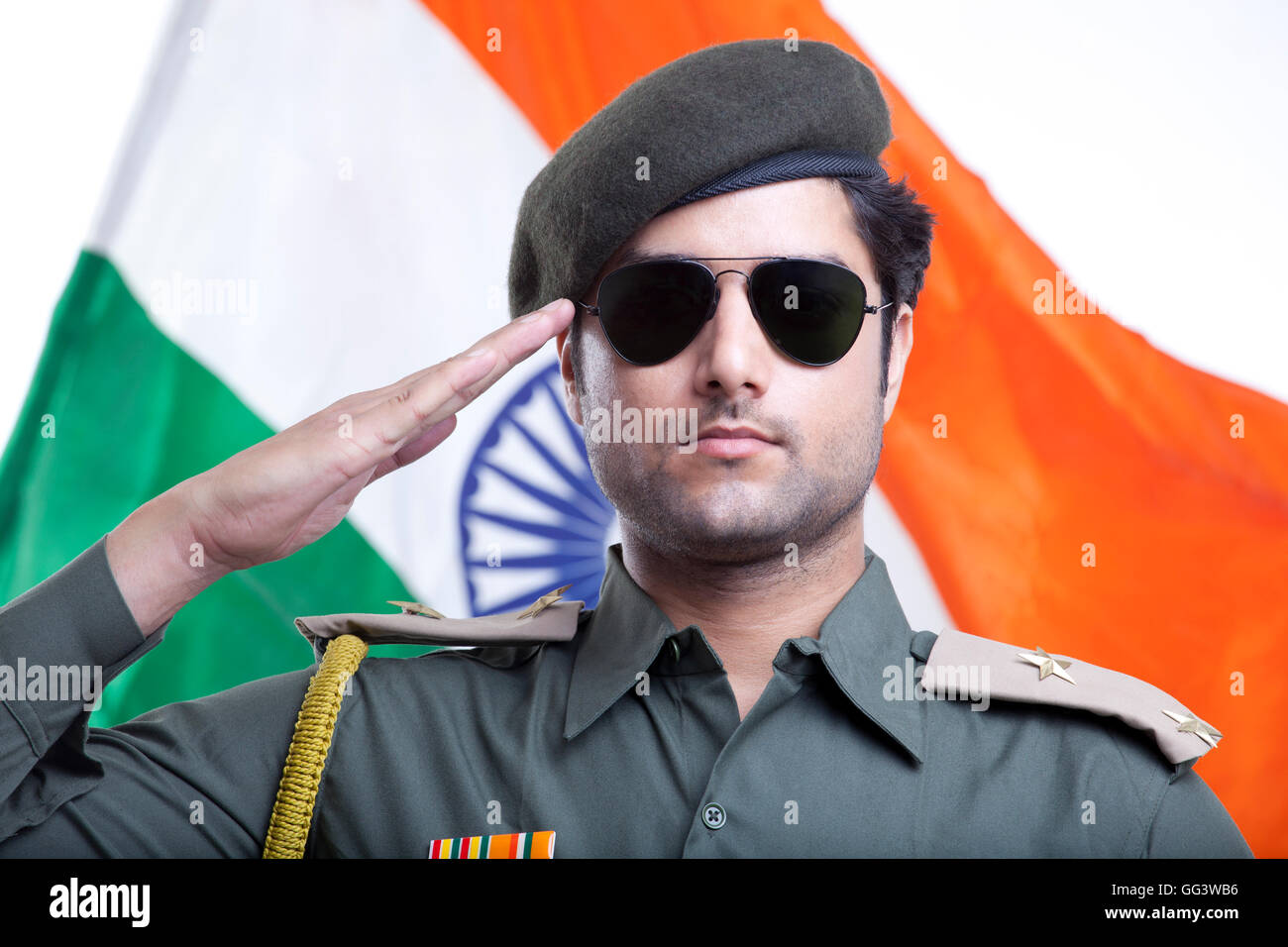 Close-up of a security guard saluting with Indian flag in the ...