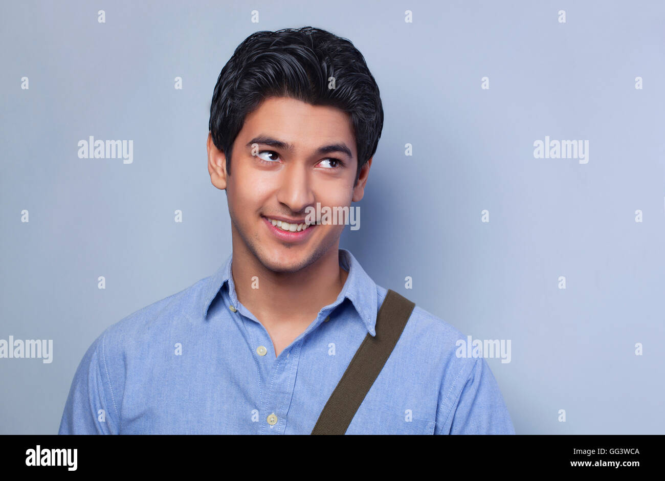 Smiling college student looking up Stock Photo - Alamy