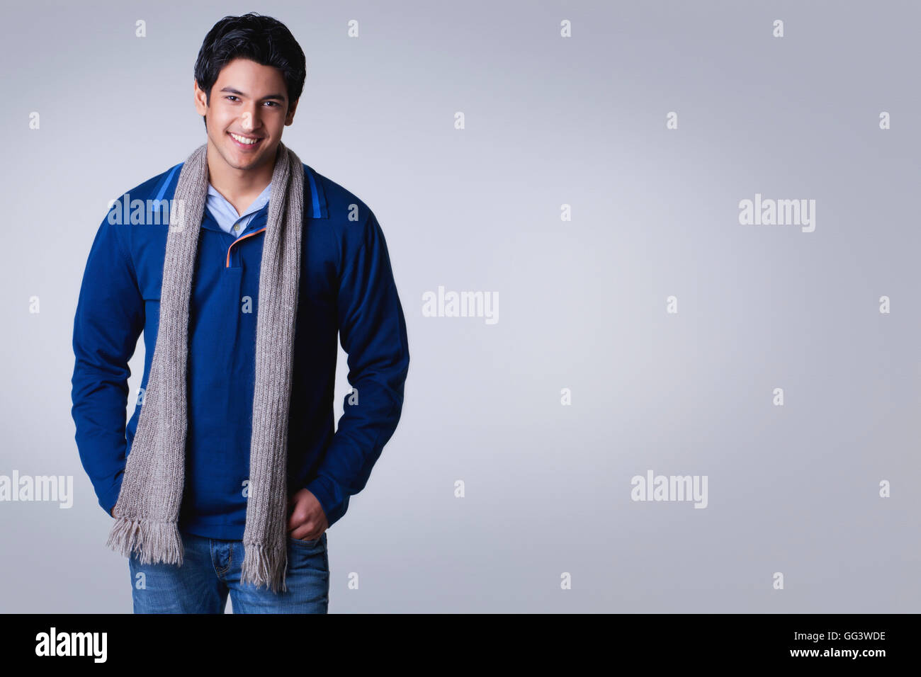 Young fashion model standing over colored background Stock Photo - Alamy