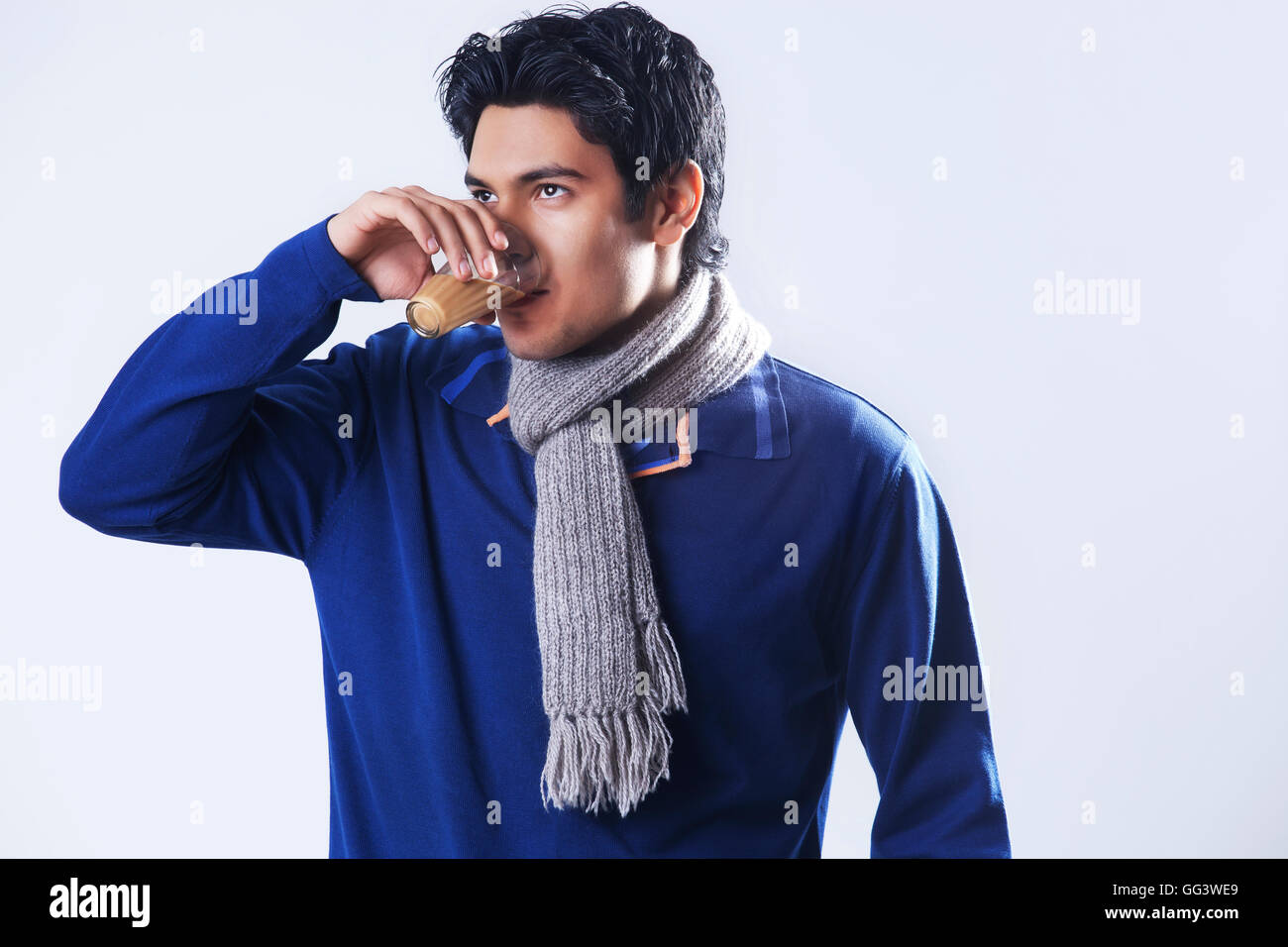 Man in smart casual drinking tea Stock Photo - Alamy
