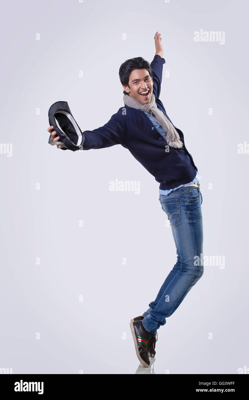 Young man dancing over colored background Stock Photo - Alamy