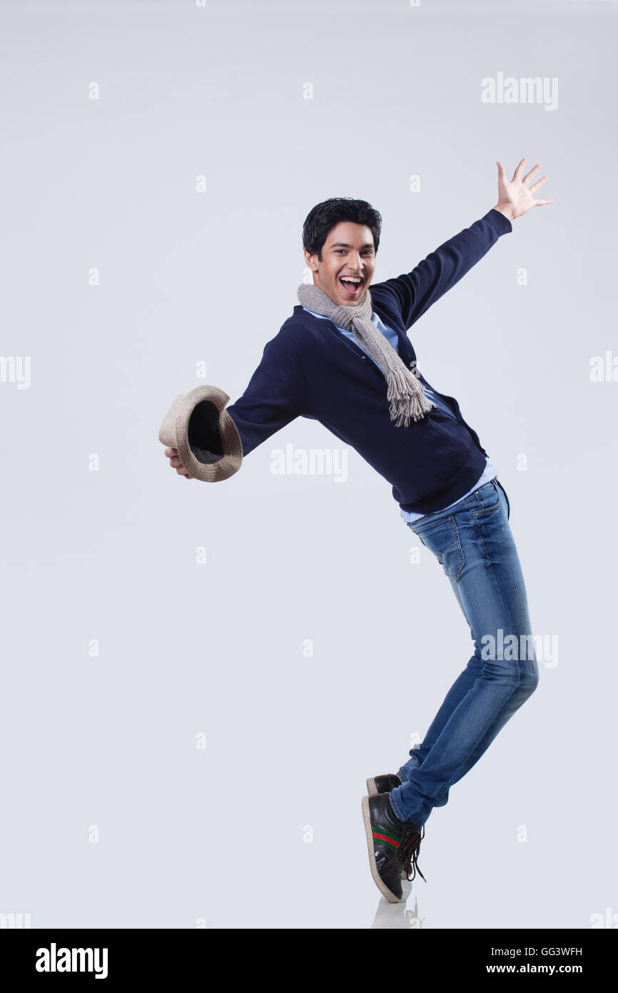 Portrait of man dancing over colored background Stock Photo - Alamy